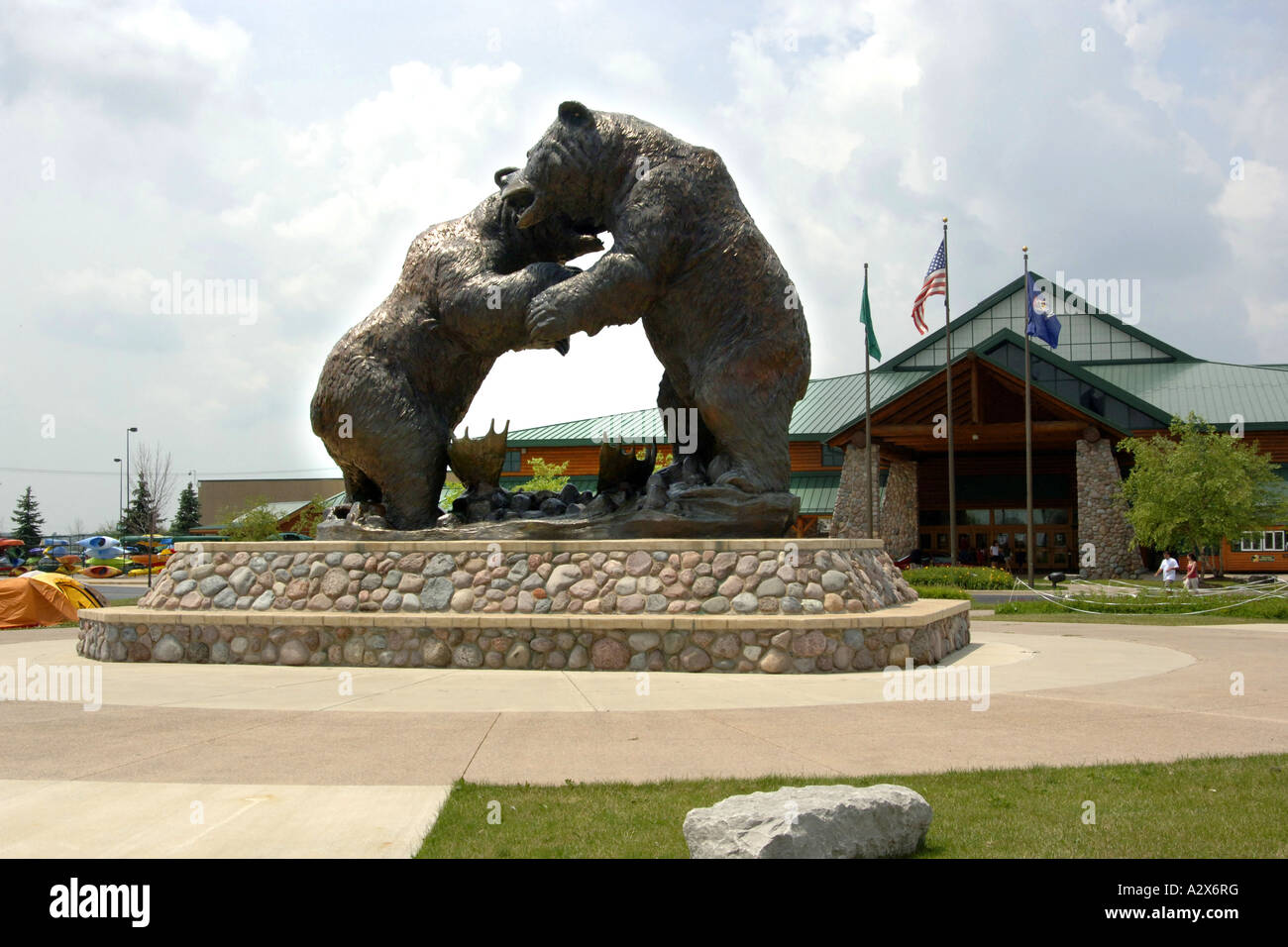 Two giant bronze statues of bears fighting outside a camping store in ...