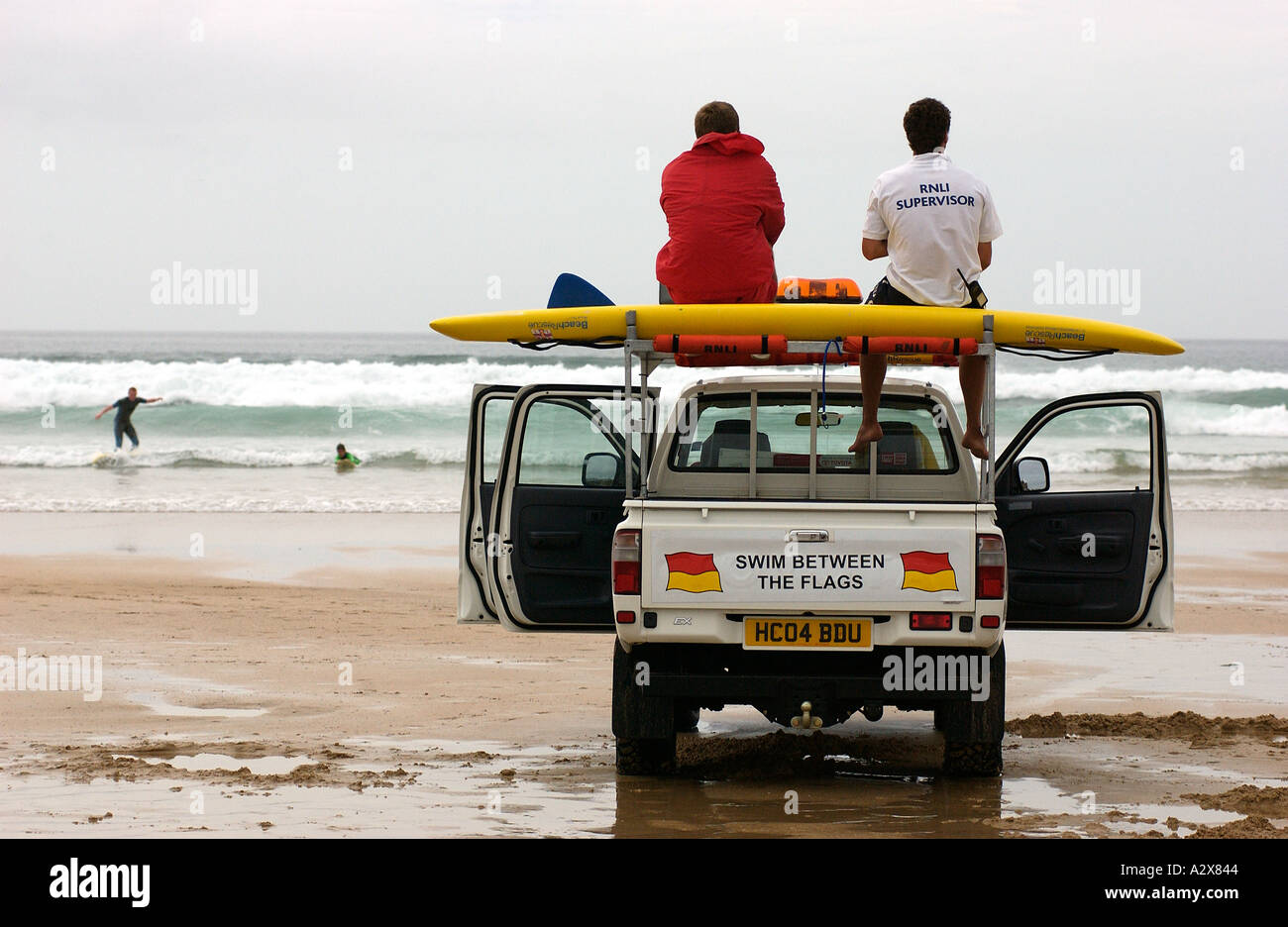RNLI beach lifeguards at Fistral Beach Newquay in Cornwall England UK ...