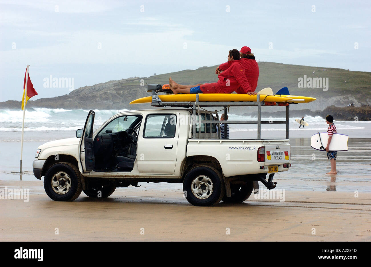RNLI beach lifeguards at Fistral Beach Newquay in Cornwall England UK ...