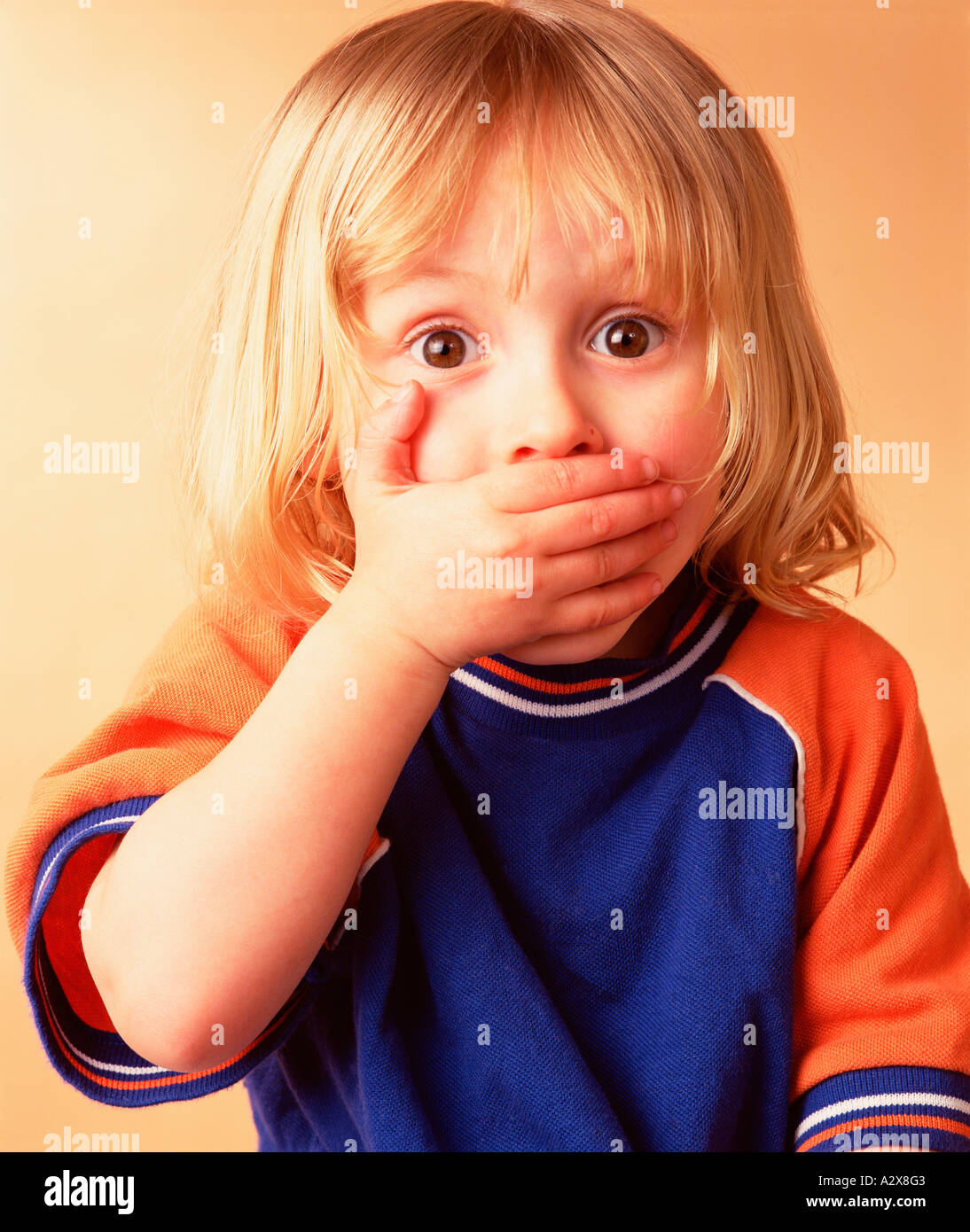 Child hand over mouth hi-res stock photography and images - Alamy