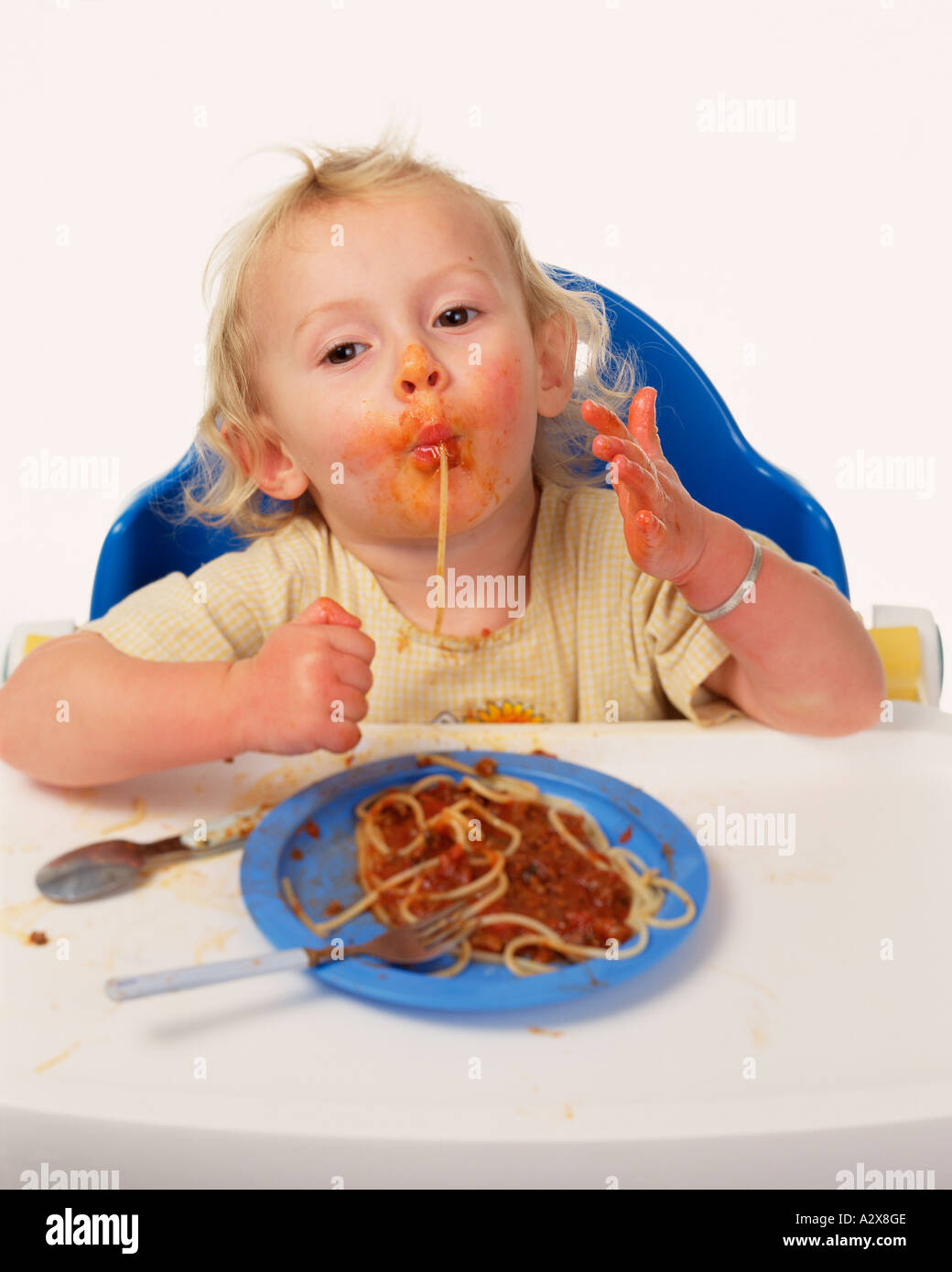 Child eating spaghetti Stock Photo - Alamy