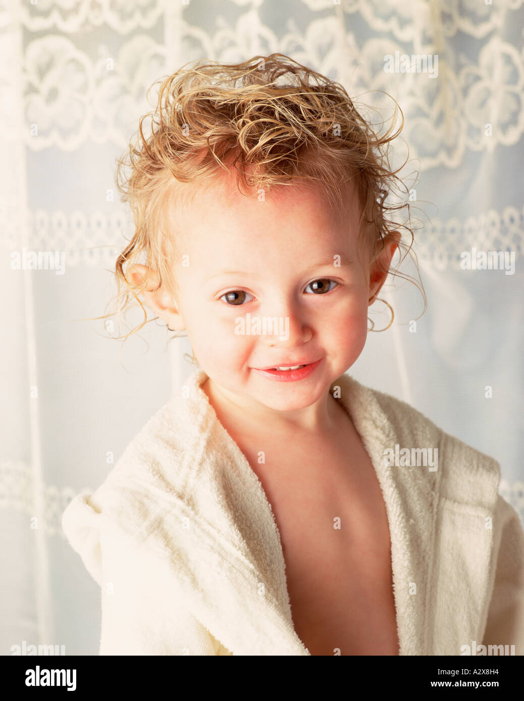 Children. Little girl wearing dressing gown indoors Stock Photo - Alamy
