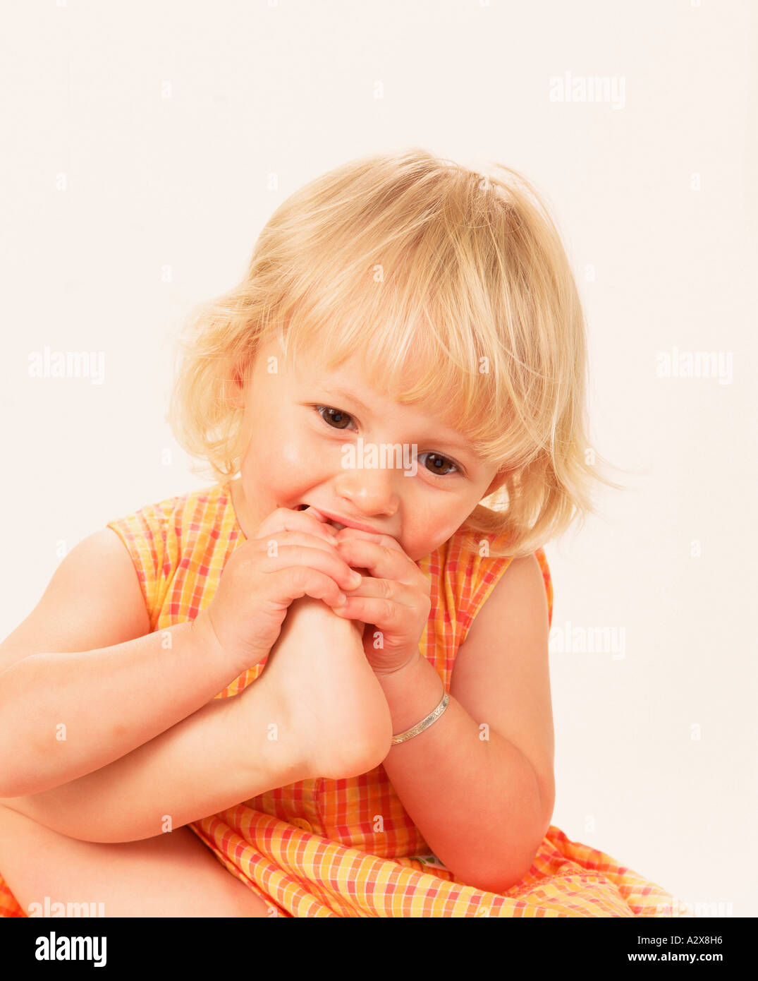Girl chewing her toe hi-res stock photography and images - Alamy