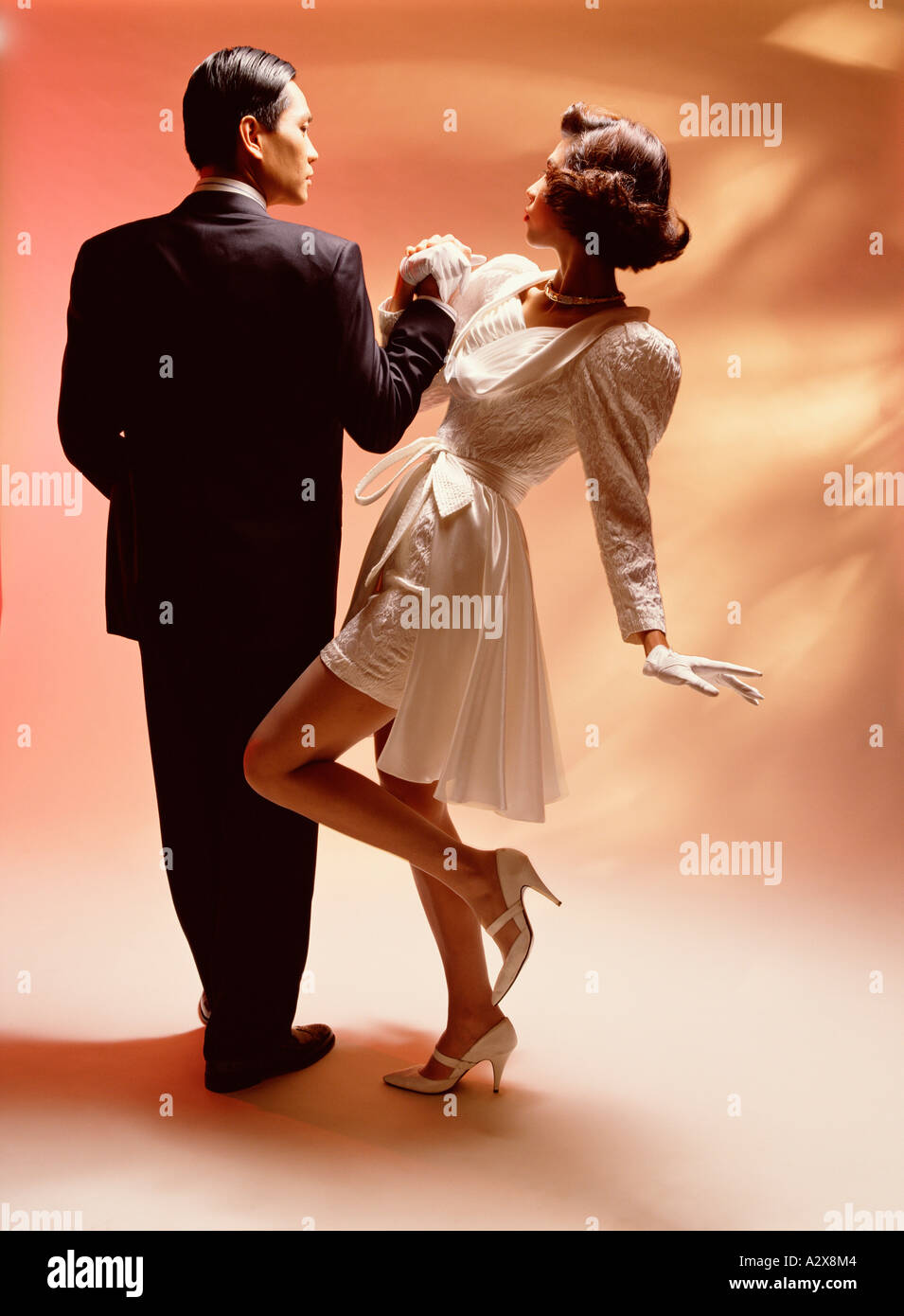 Studio image of Chinese couple dancing Stock Photo - Alamy