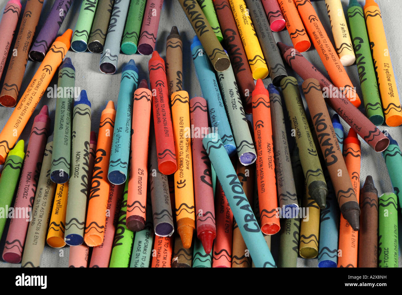Multi colored Wax Crayons against a grey background Stock Photo - Alamy