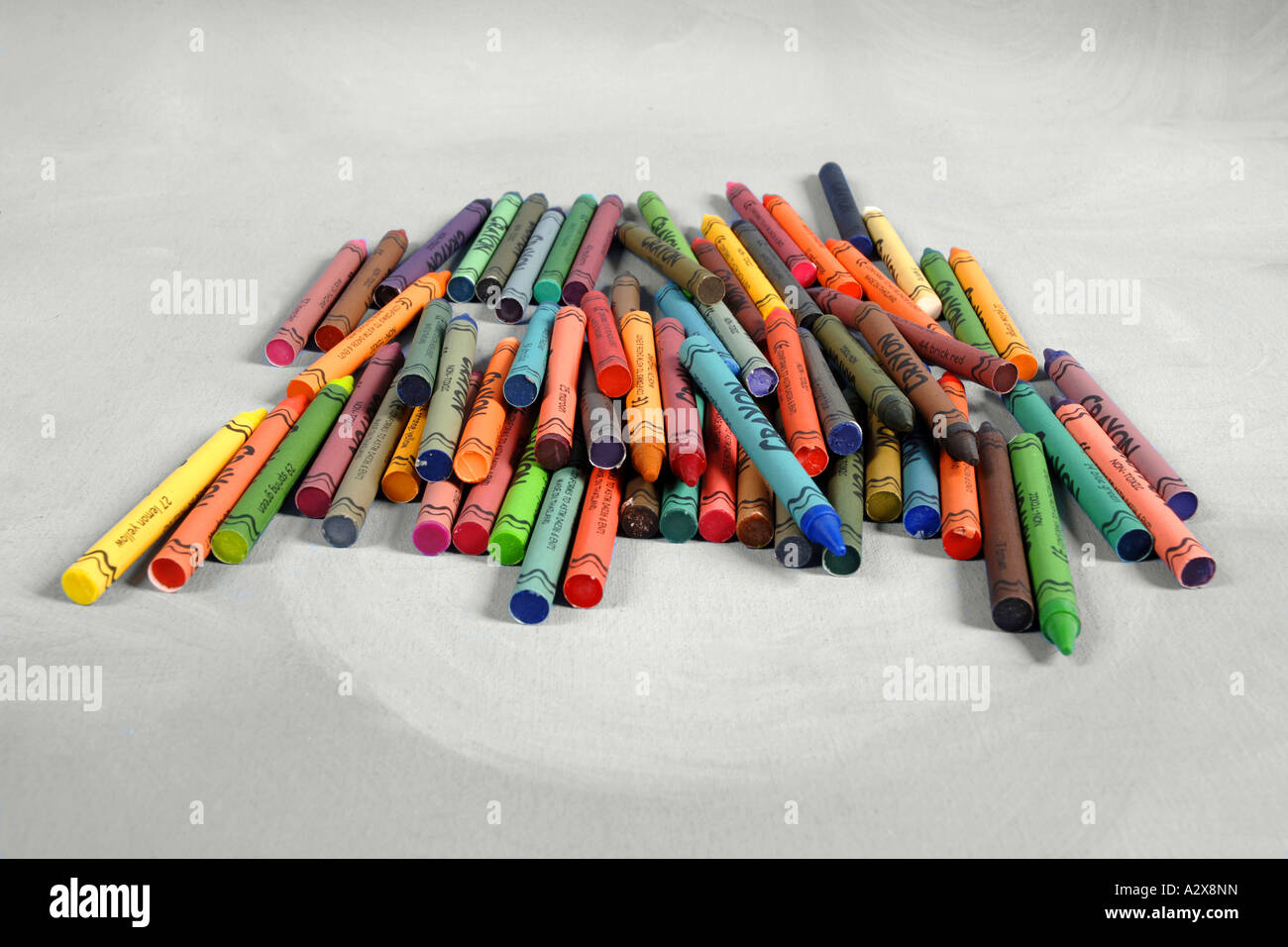Multi colored Wax Crayons against a grey background Stock Photo - Alamy