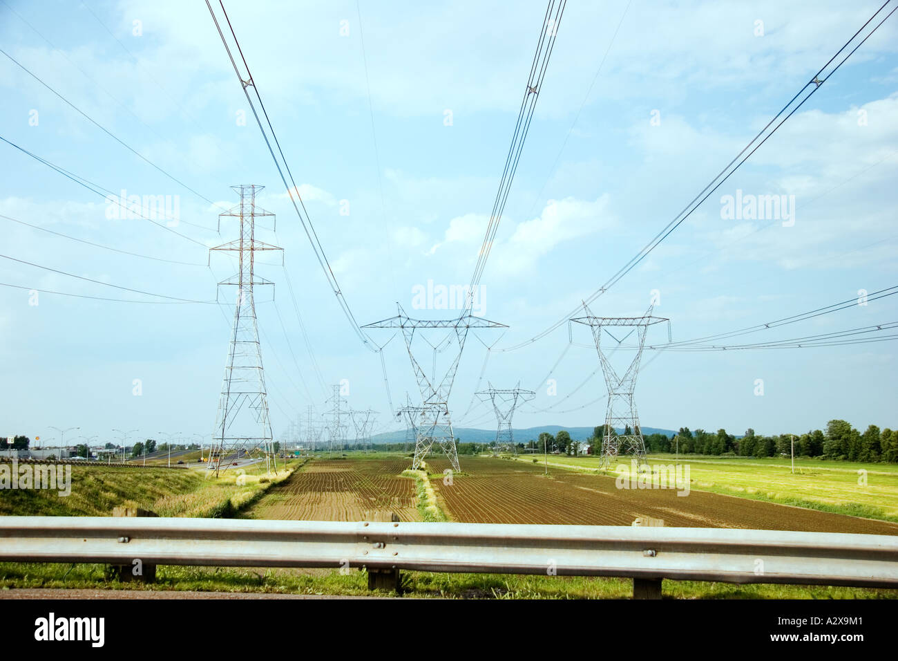 Electrical power lines in a farmers field Stock Photo - Alamy