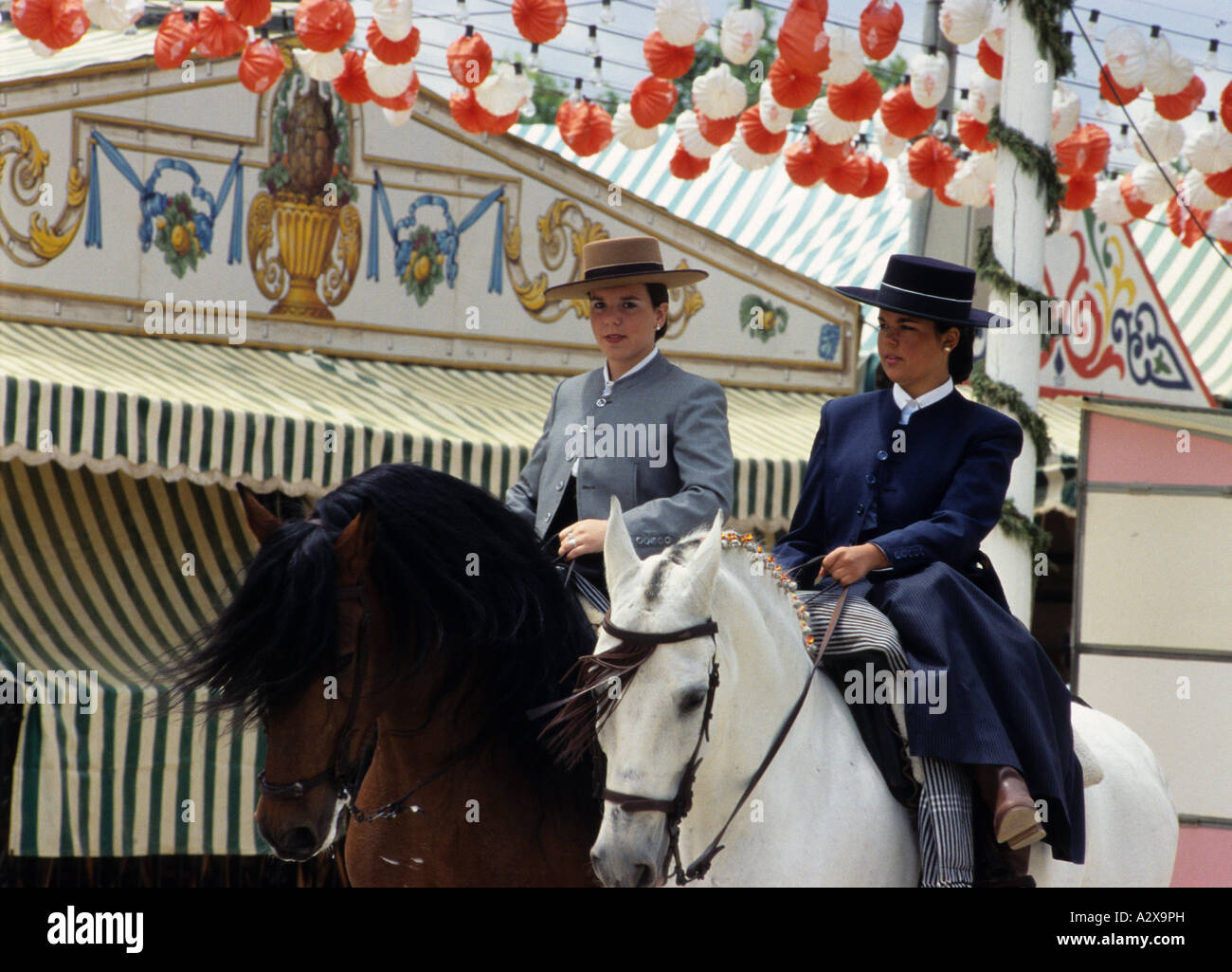 Women riding in parade at Feria de Abril, Seville Stock Photo - Alamy