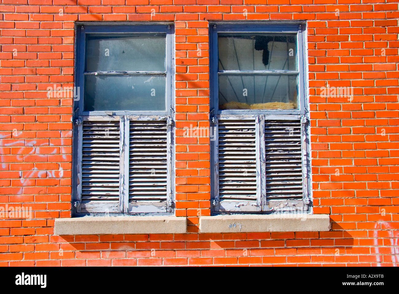 Windows on a red, brick wall Stock Photo - Alamy