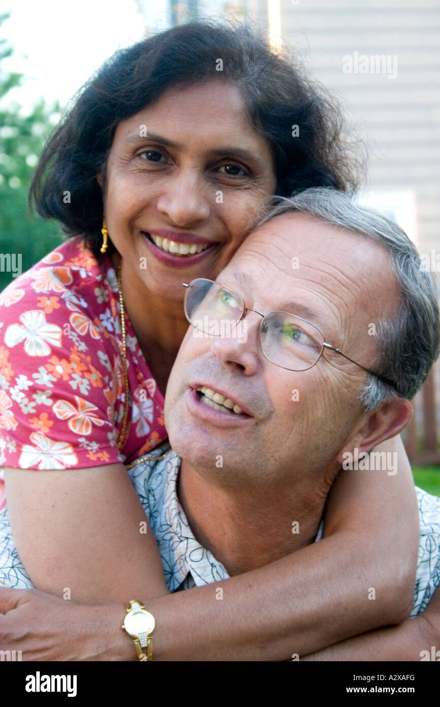 Lucky man enjoying a warm embrace from his wife age 60. St Paul ...