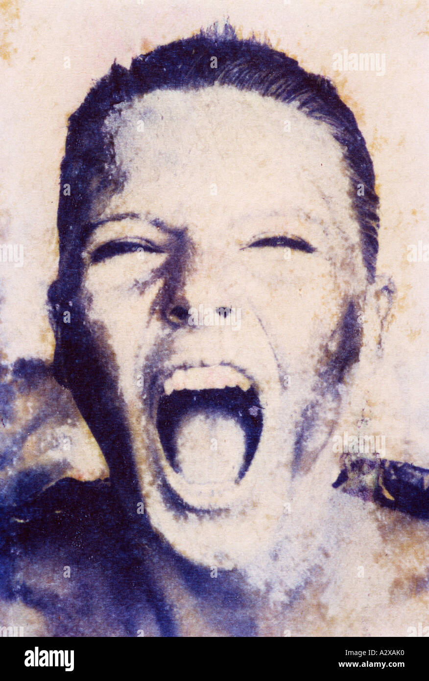 Close-up of young woman's face with screaming, shouting expression ...