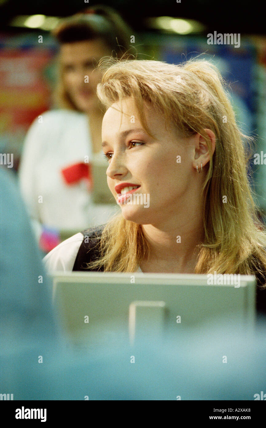 Young woman working indoors in retail shop premises Stock Photo - Alamy