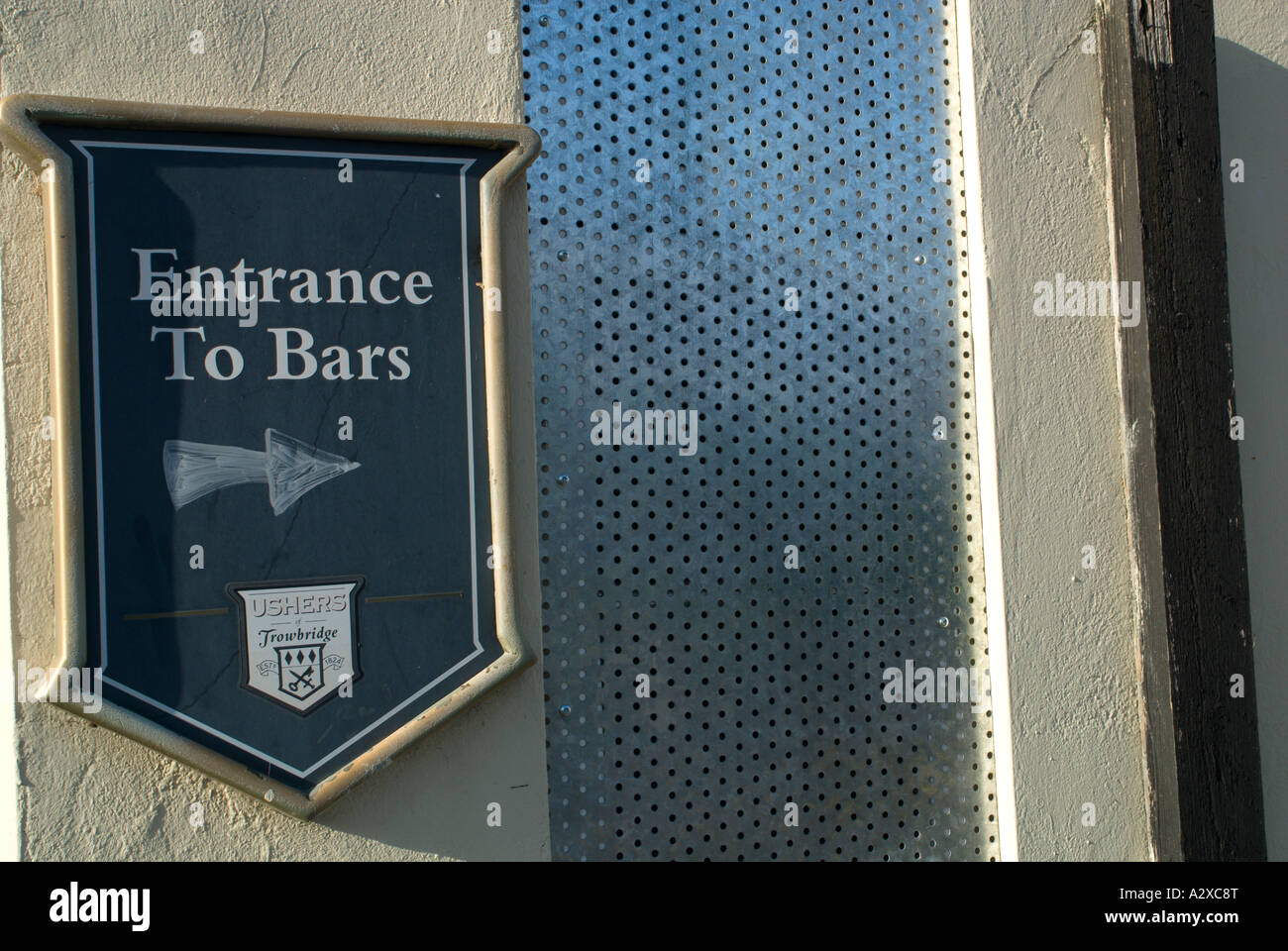 Entrance to bars sign on the outside wall of a Pub The Pub however is ...