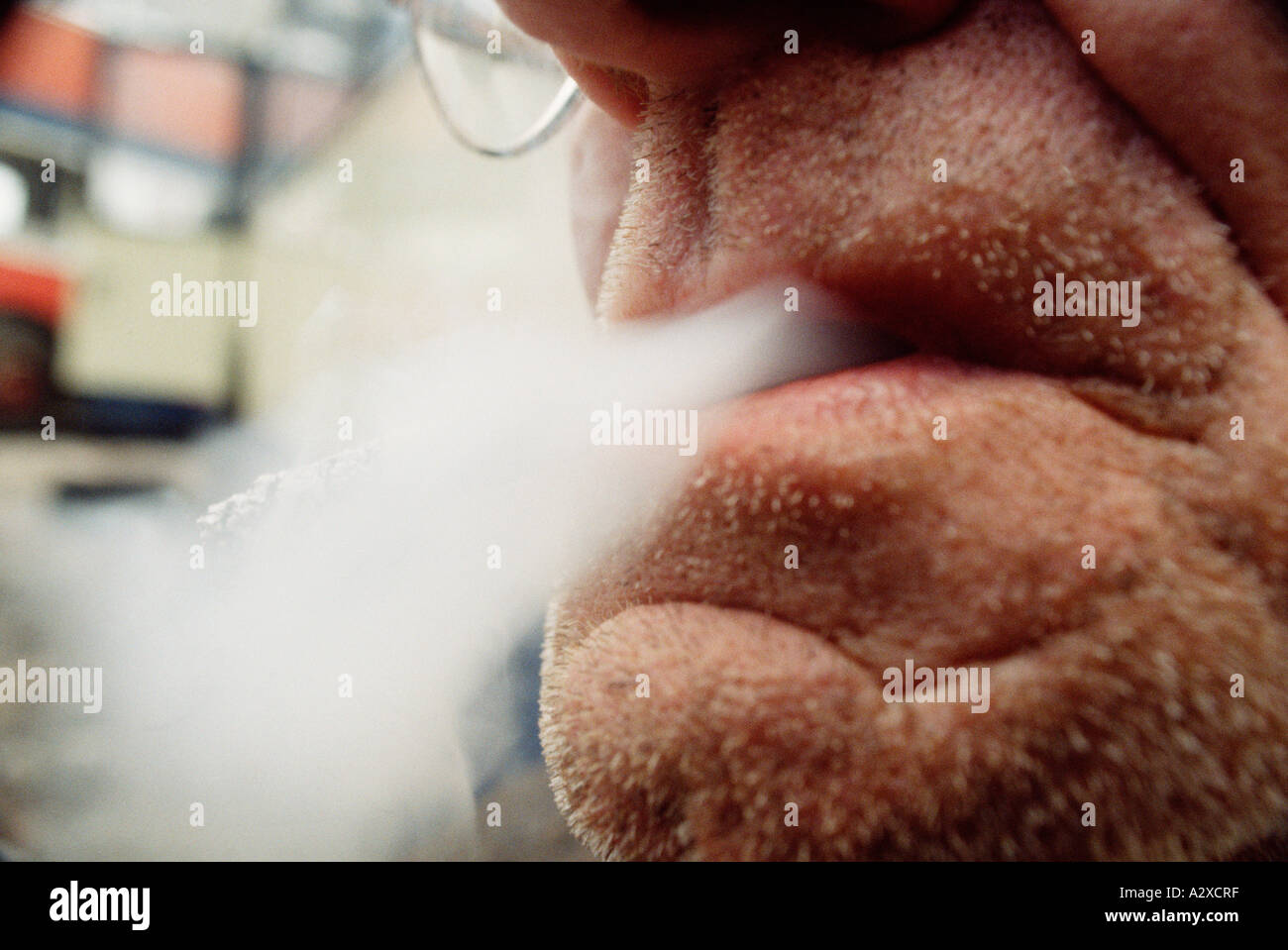Older man smoking cigarettes hi-res stock photography and images - Alamy