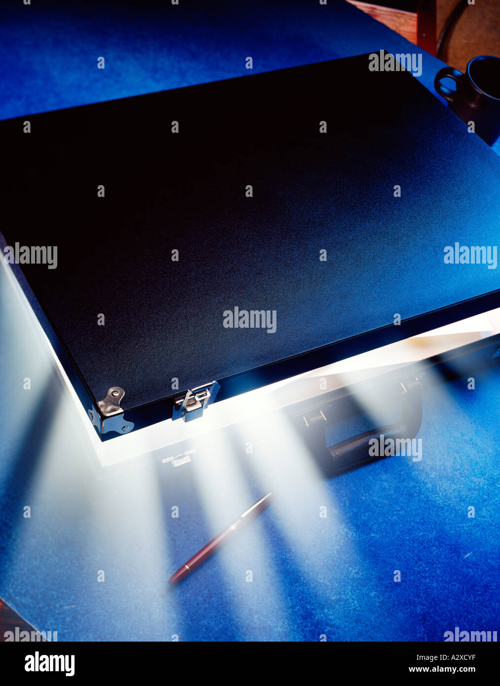 Concept. Light emitting briefcase Stock Photo - Alamy