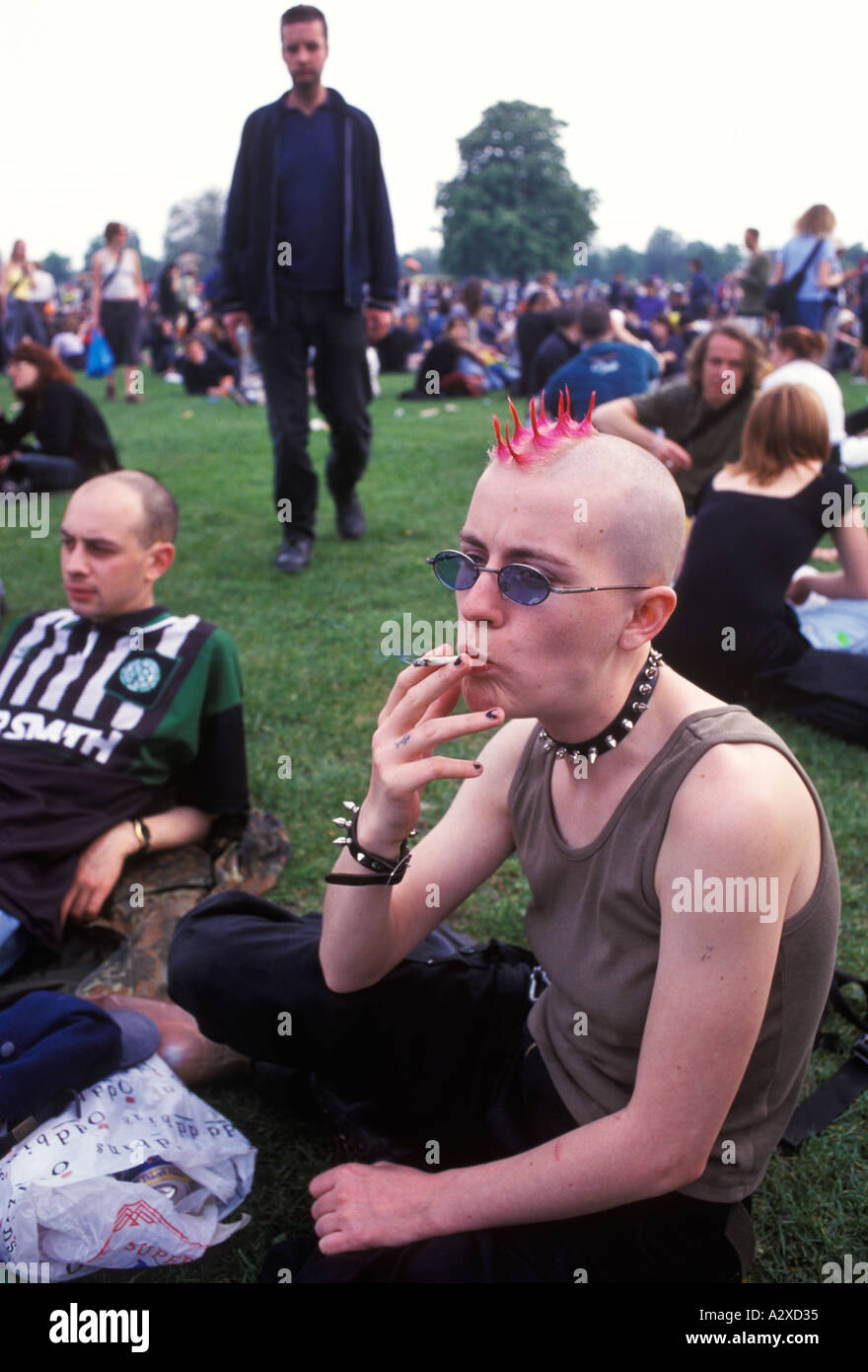 Punk woman teen, smoking a joint at a Legalise Cannabis rally and march ...