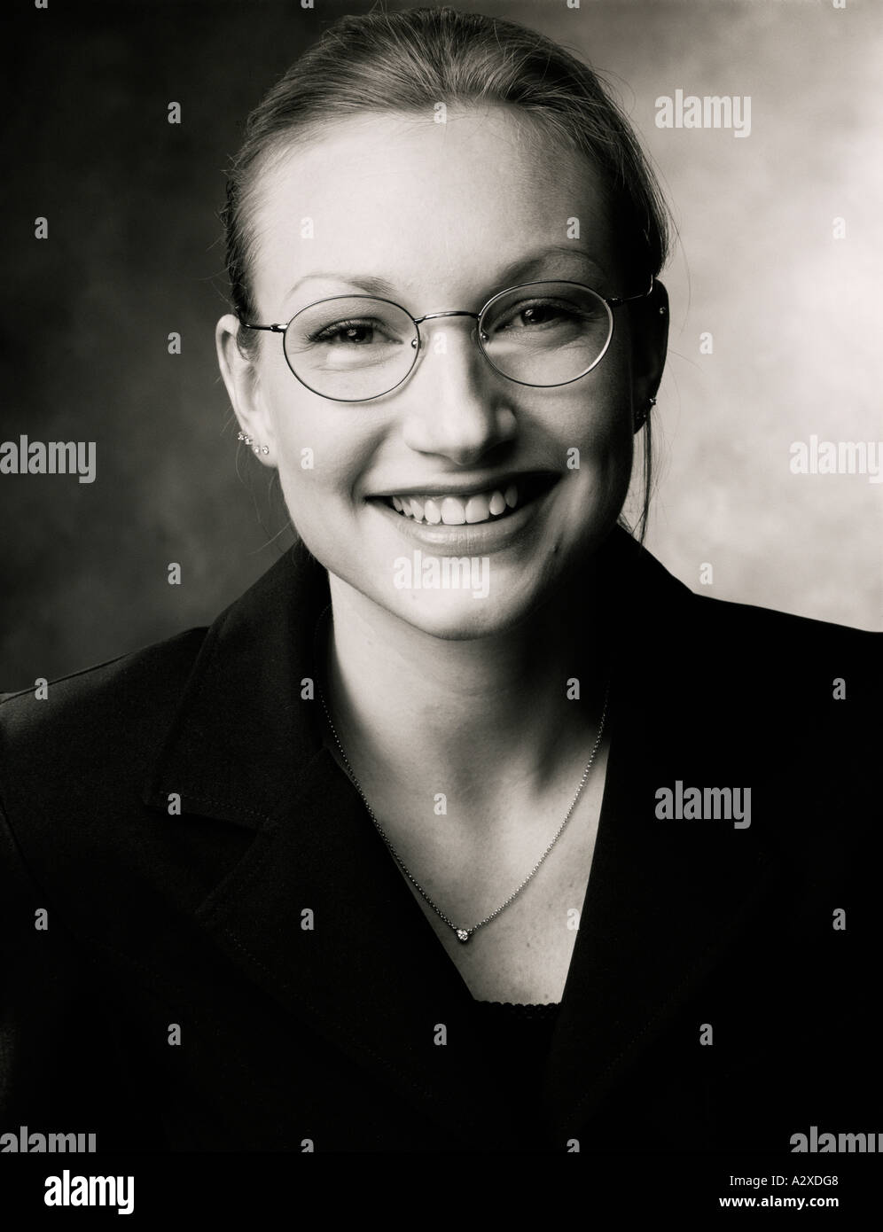 Indoor studio portrait of a young woman wearing spectacles Stock Photo ...