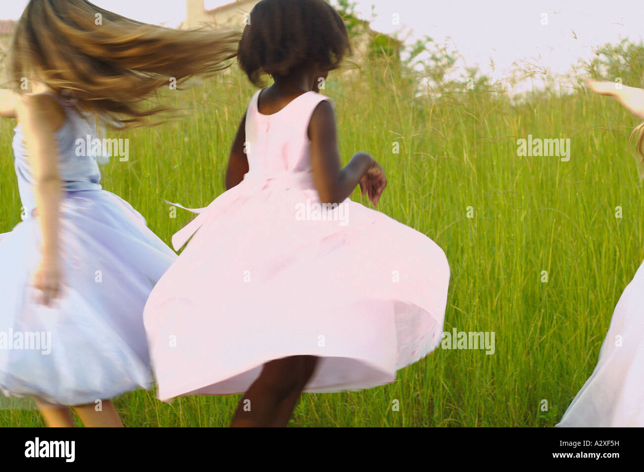 Girls wearing dresses hi-res stock photography and images - Alamy