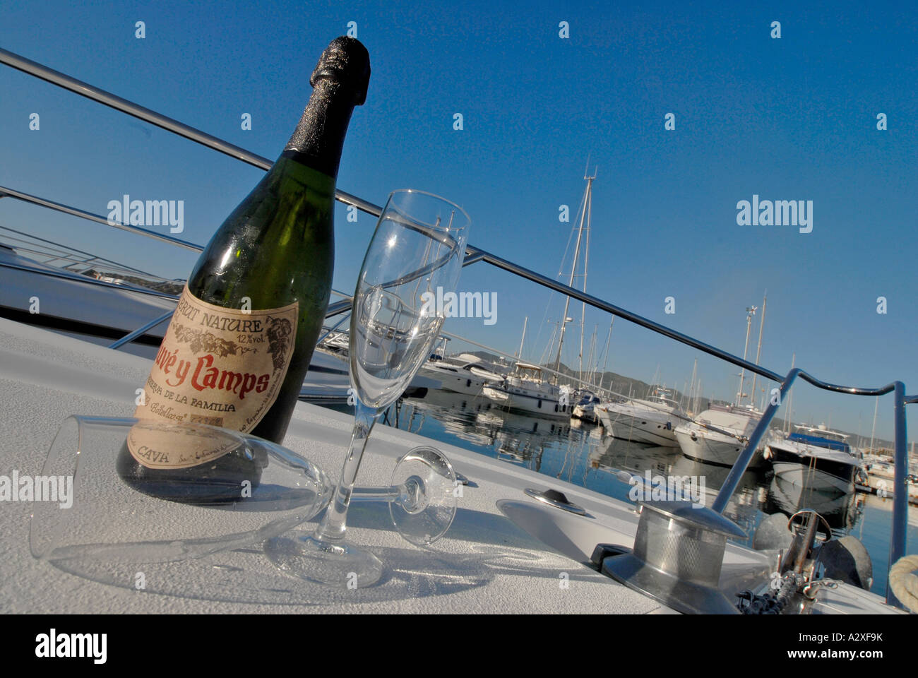 Cava bottle and two cups on the front side of a luxurious yacht in ...
