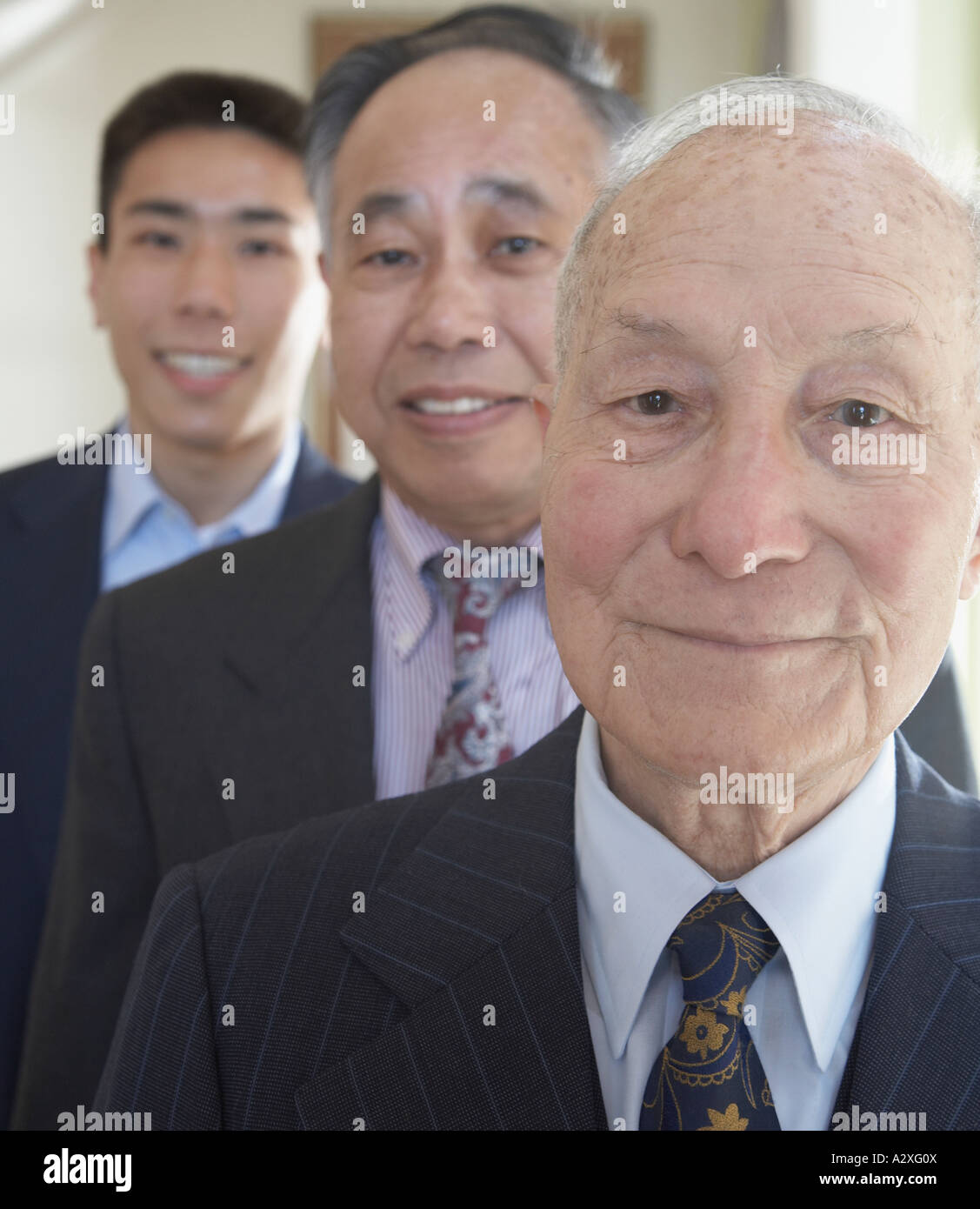 Senior Asian man with family members in background Stock Photo - Alamy