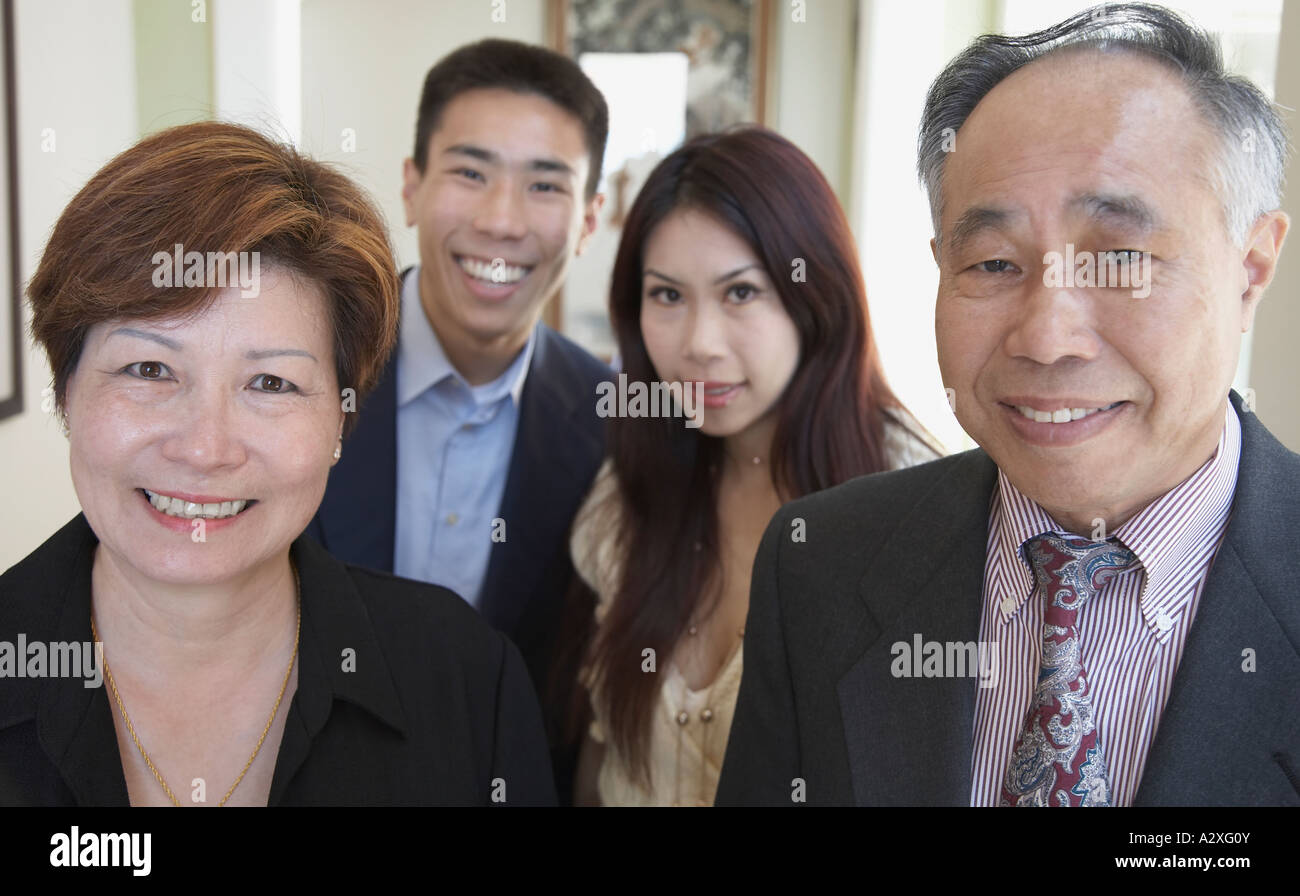 Asian family smiling indoors Stock Photo - Alamy