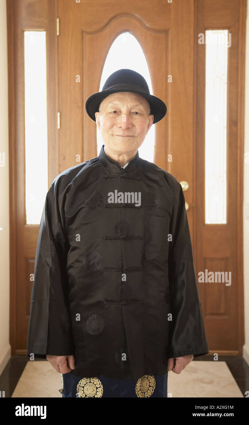 Senior Asian man smiling in traditional dress Stock Photo - Alamy