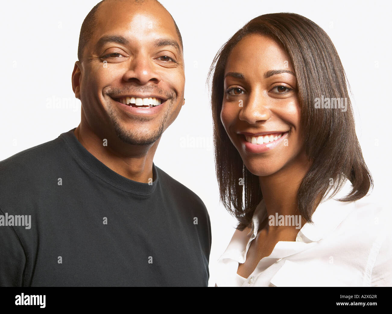 Studio shot of African couple smiling Stock Photo - Alamy