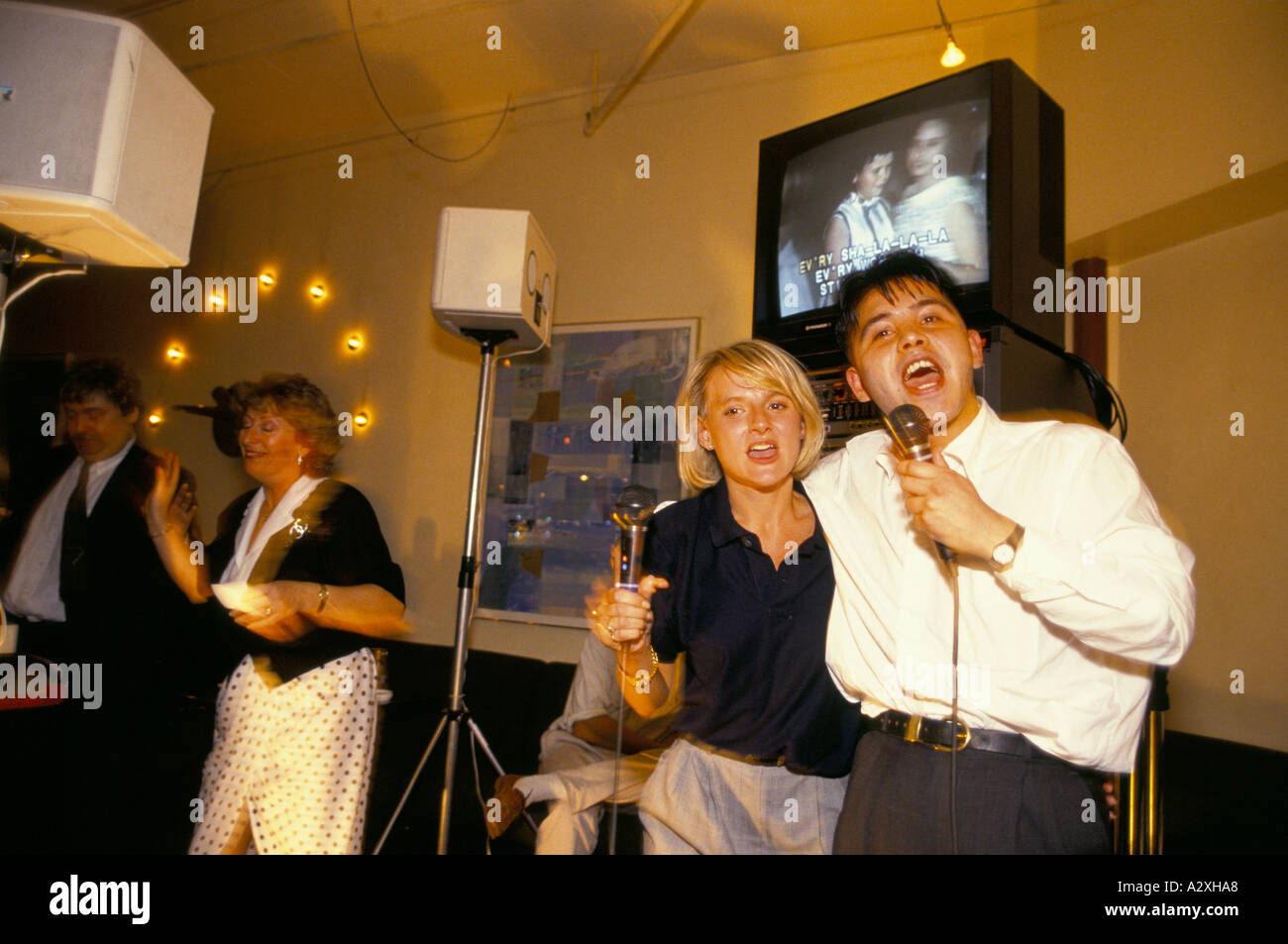 city workers singing karaoke after work Stock Photo - Alamy