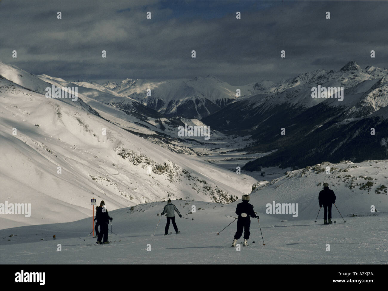 people skiing down mountain slope st moritz switzerland Stock Photo - Alamy