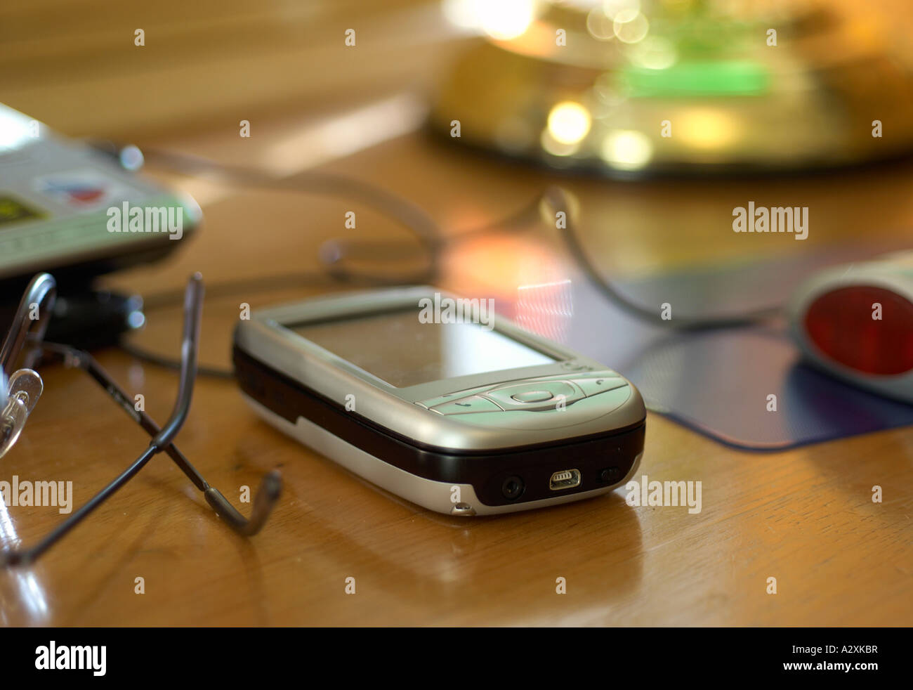 Mobile phone on a desk Stock Photo - Alamy