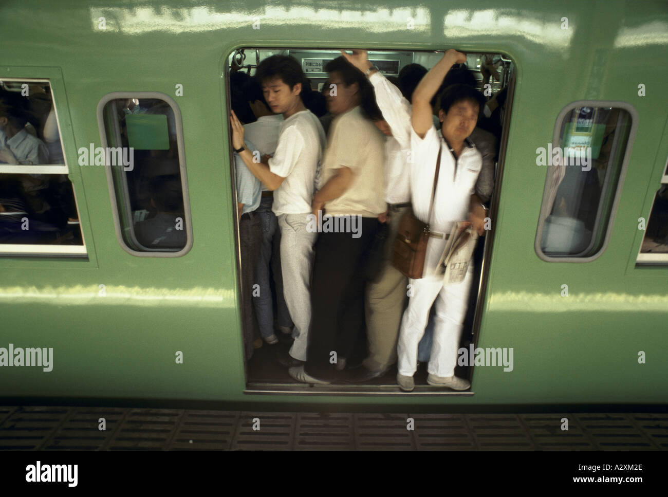 busy metro in tokyo japan train packed with passengers Stock Photo - Alamy