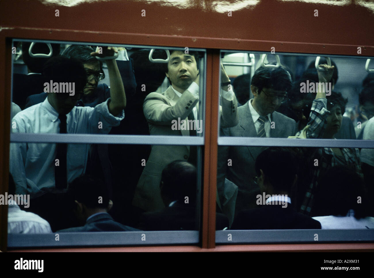busy metro in tokyo japan train packed with commuters Stock Photo - Alamy