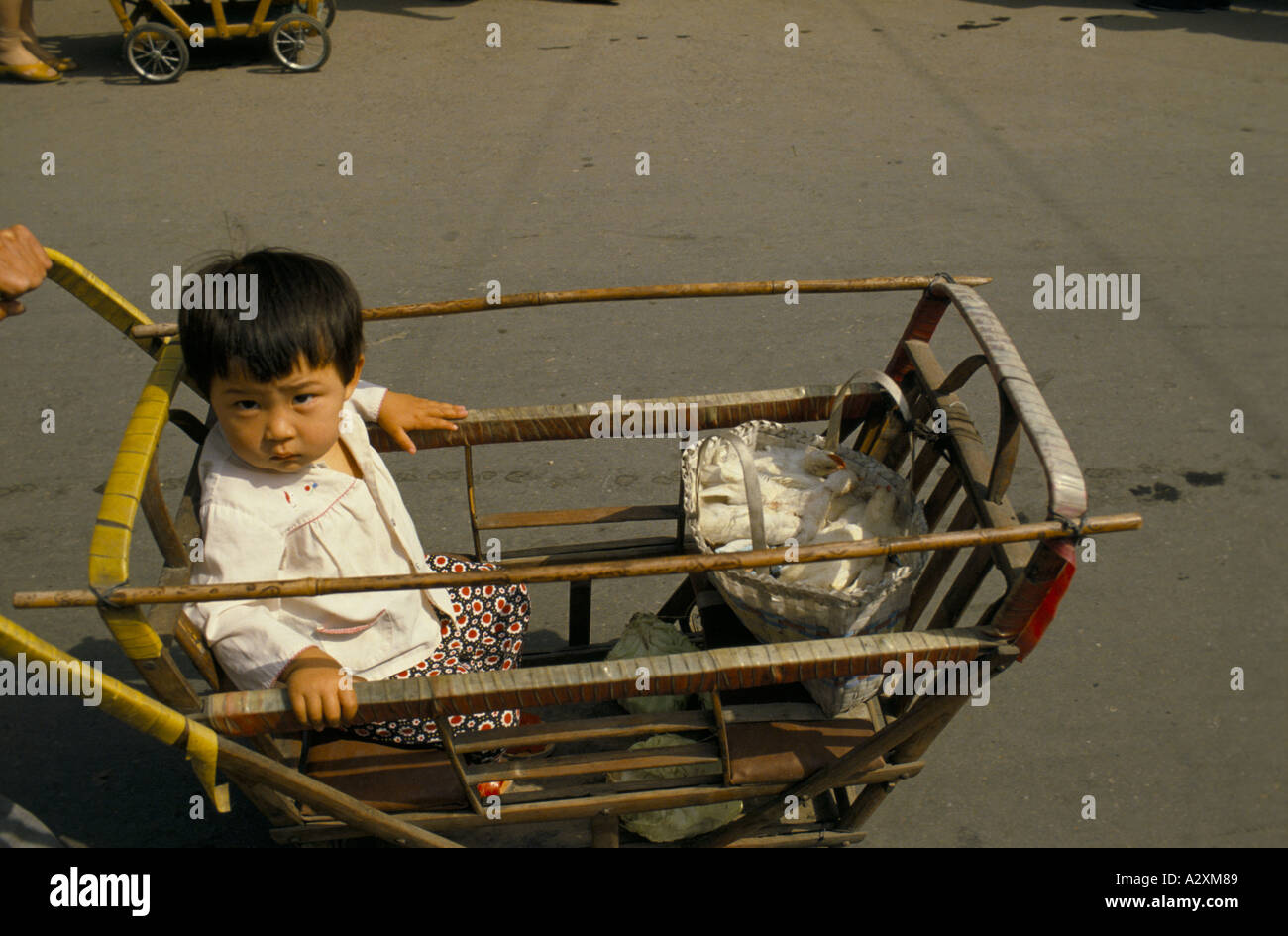 child in wooden trolley Stock Photo - Alamy