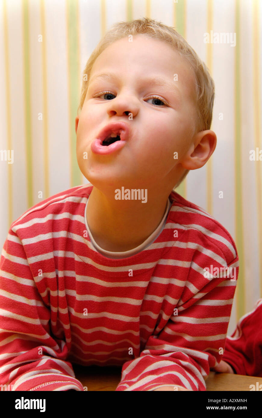 Little boy grimacing Stock Photo - Alamy