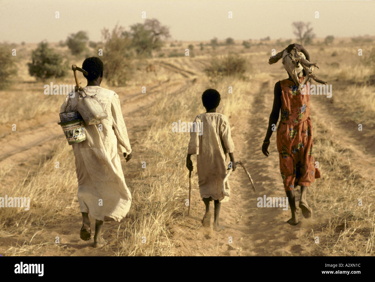 villagers migrating westward to escape drought 1990 Stock Photo - Alamy