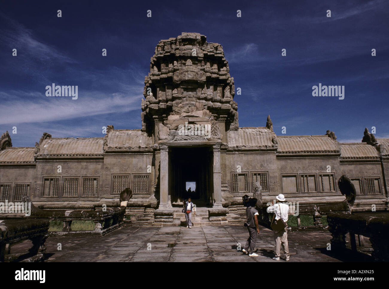 Tourists visit the 12th Century Buddhist temple complex of Angkor Wat ...
