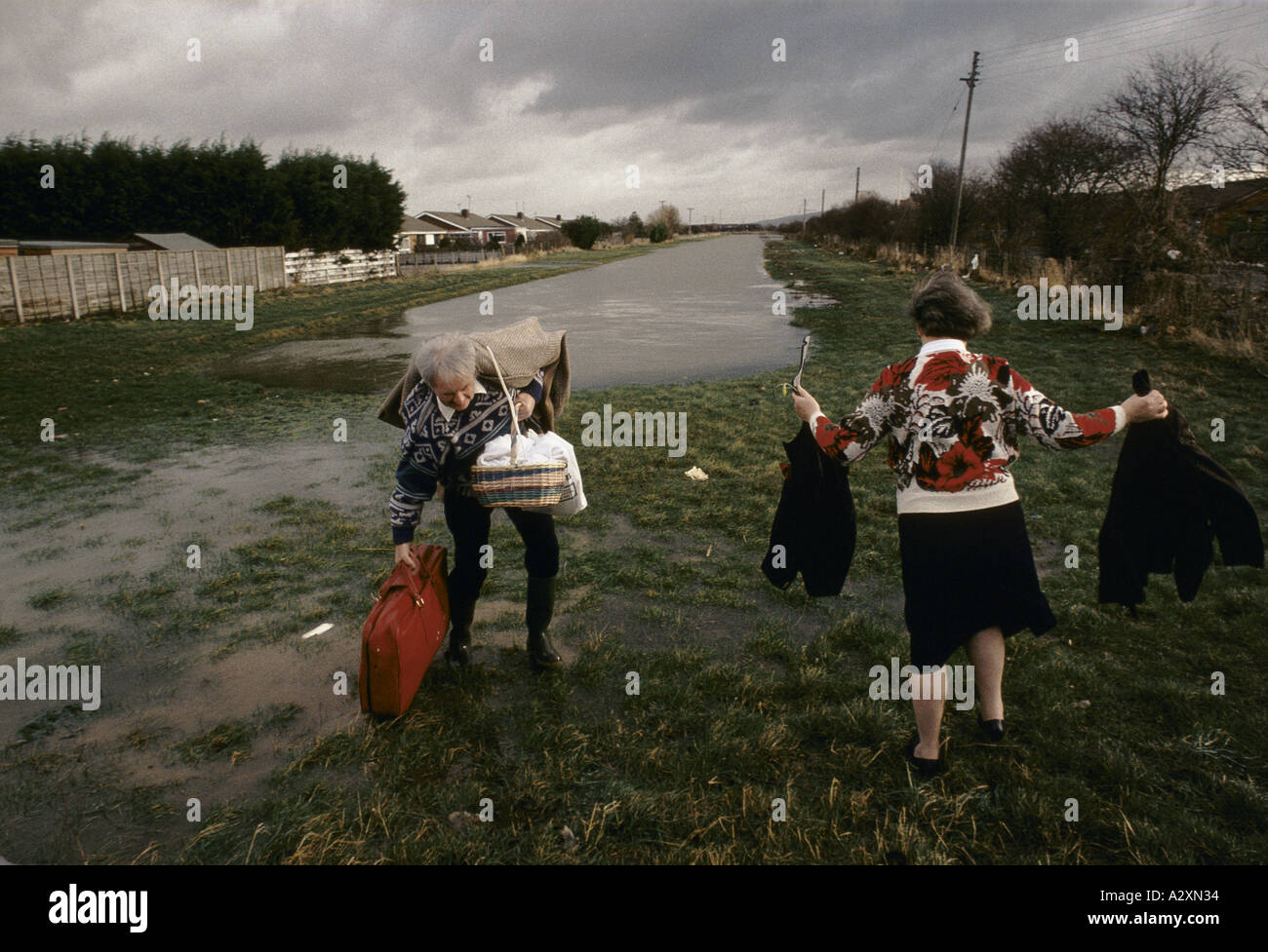 People resue belonging from their flooded houses after Hurricane winds ...