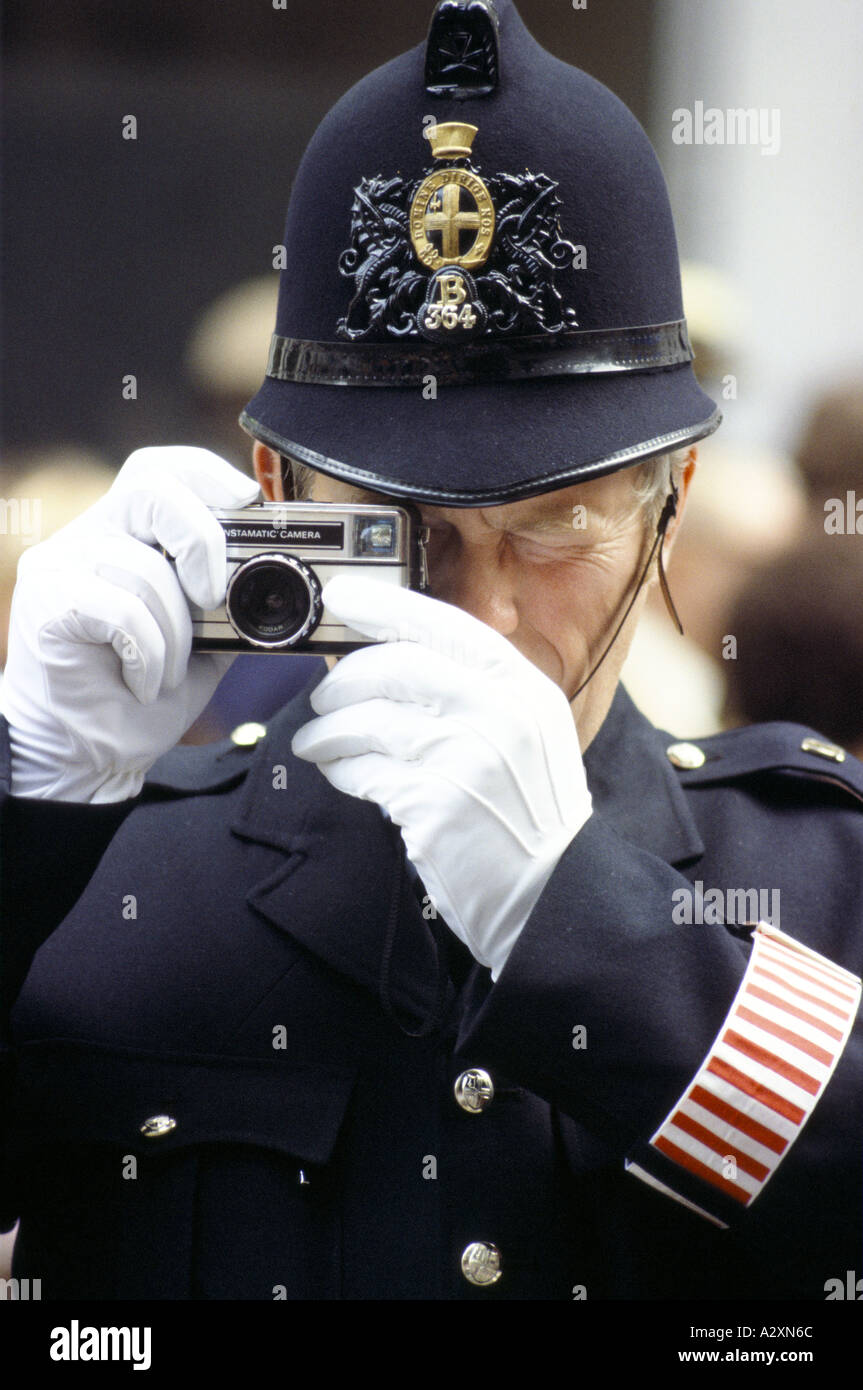 POLICEMAN TAKING PHOTO AT ROYAL WEDDING Stock Photo - Alamy