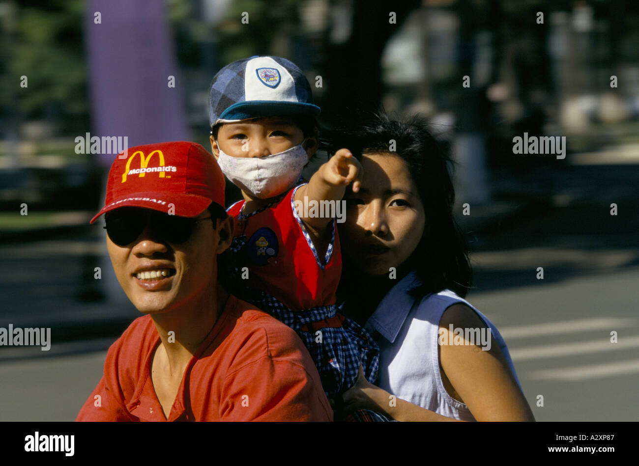 travelling by moped or bike is the norm in vietnam ho chi minh city Stock Photo - Alamy