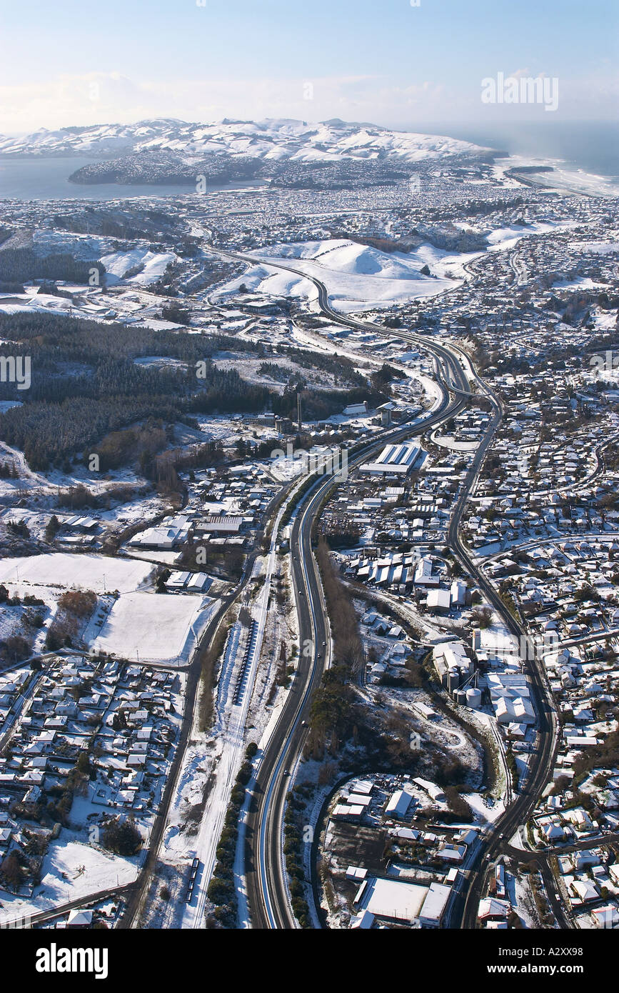 Southern Motorway and snow Dunedin South Island New Zealand aerial ...
