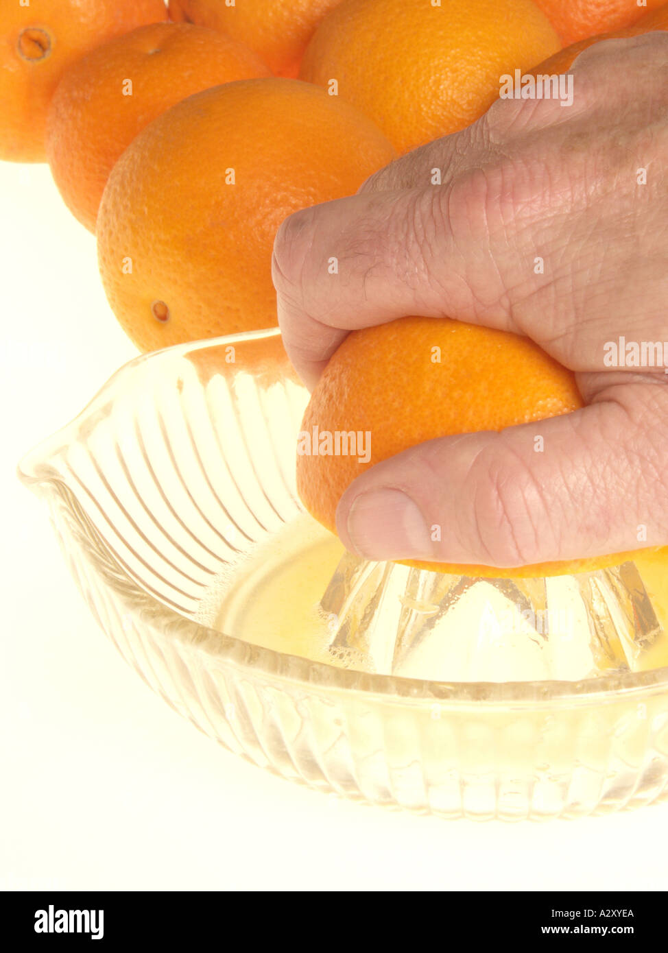 Squeezing orange juice Stock Photo - Alamy