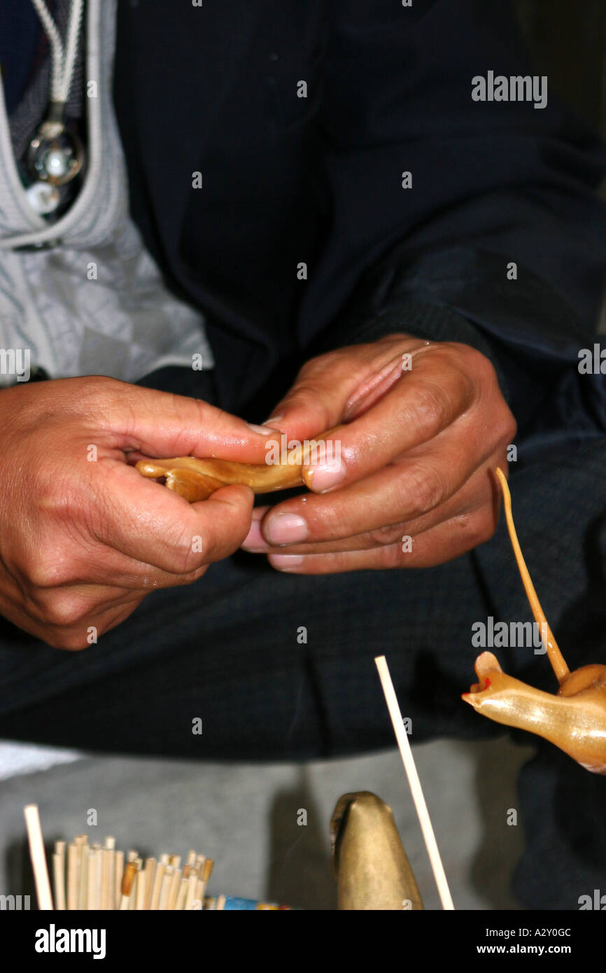 Street vendor making caramel animals in the hutongs Beijing Stock Photo ...