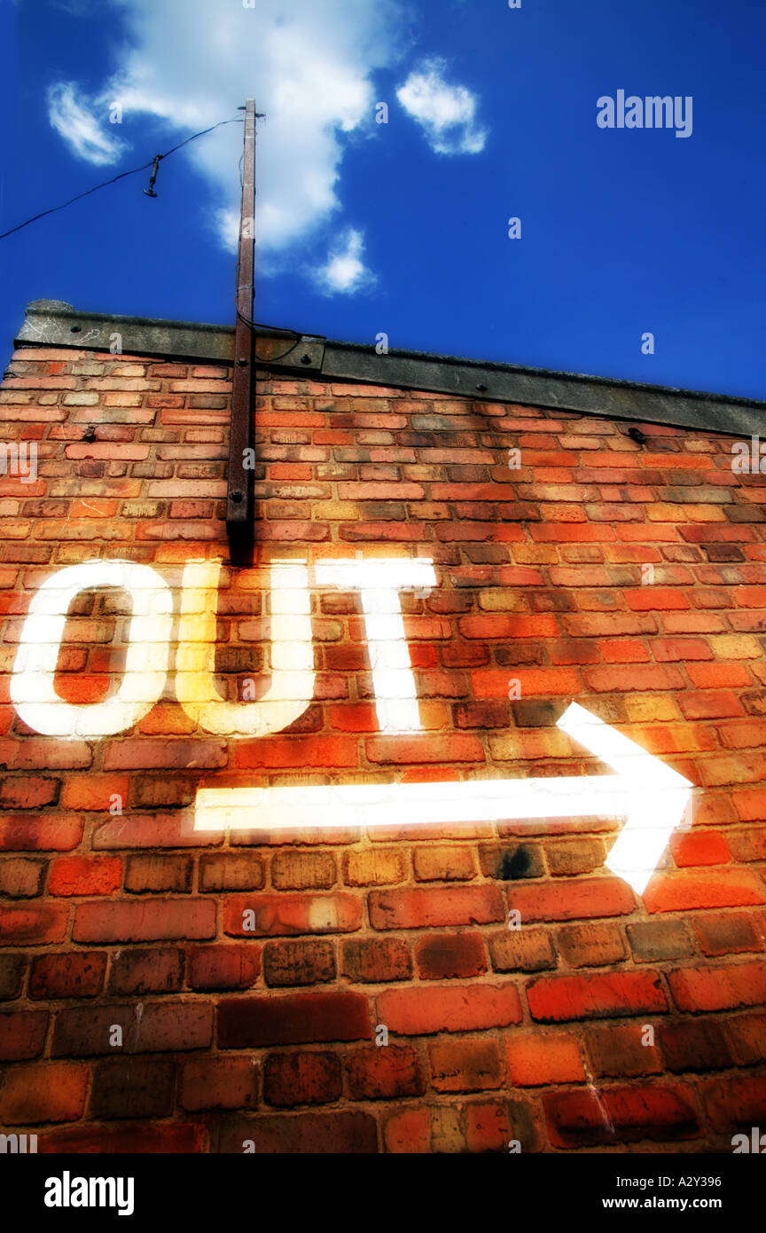 brick wall with blue sky this way out Stock Photo - Alamy