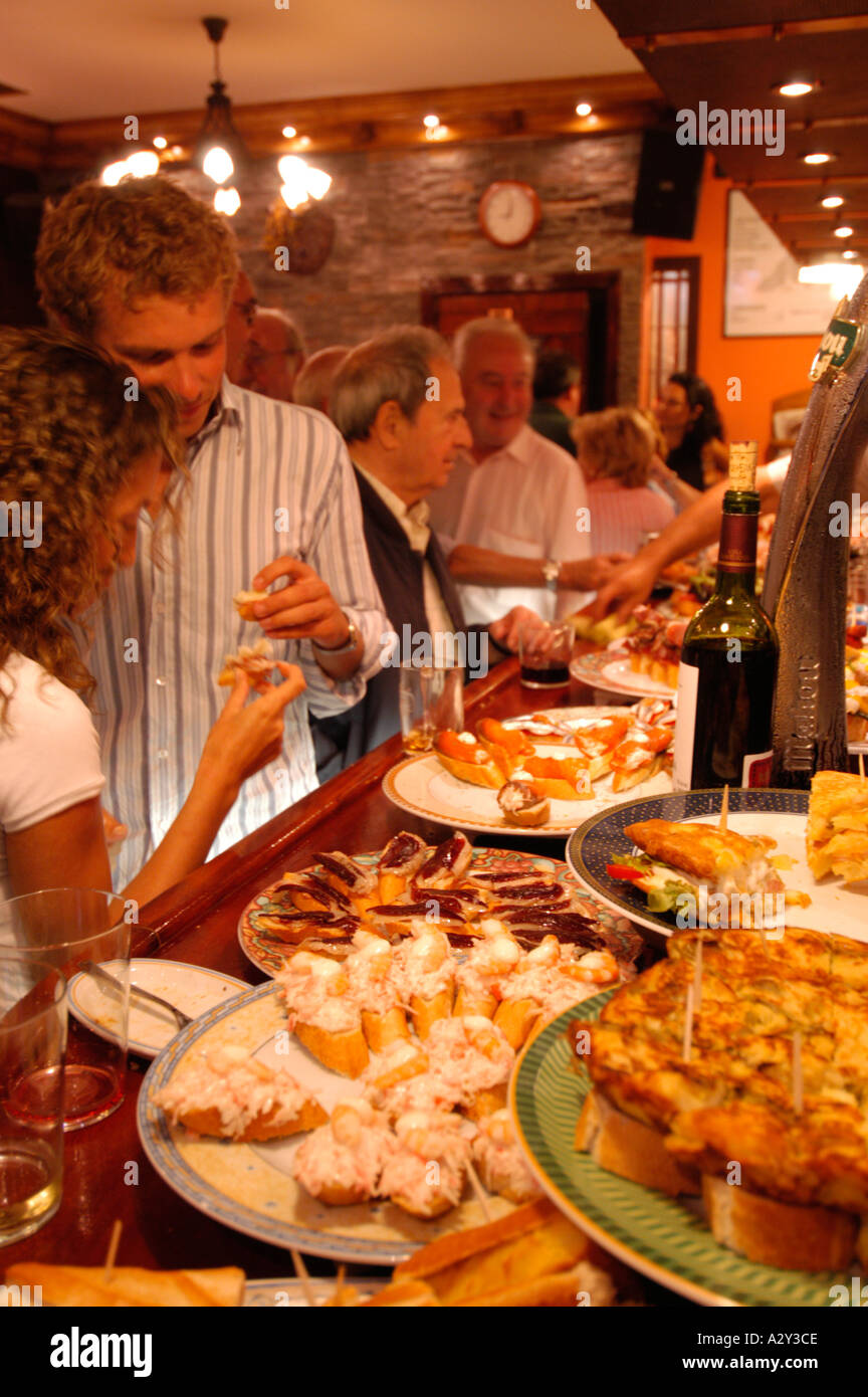 People eating tapas at a bar in San Sebastian, Spain Stock Photo - Alamy