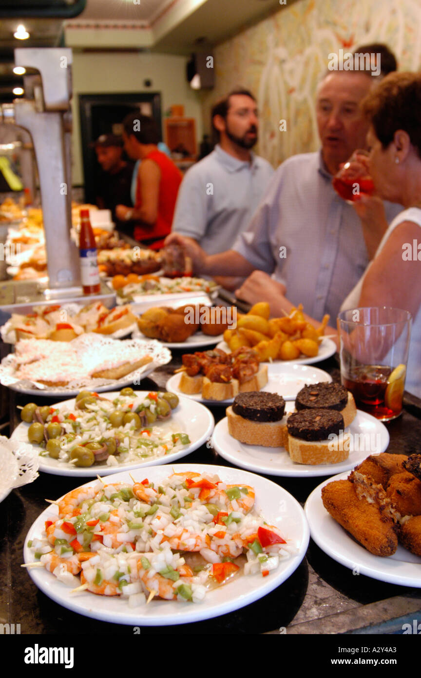 People eating tapas at a bar in San Sebastian, Spain Stock Photo - Alamy