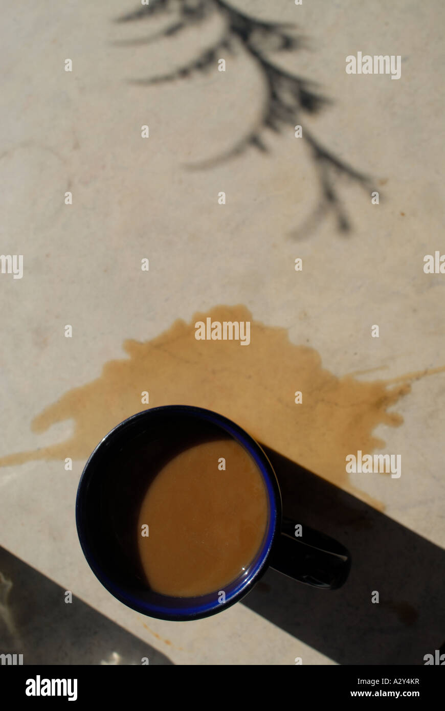 Spilt coffee on table Stock Photo - Alamy