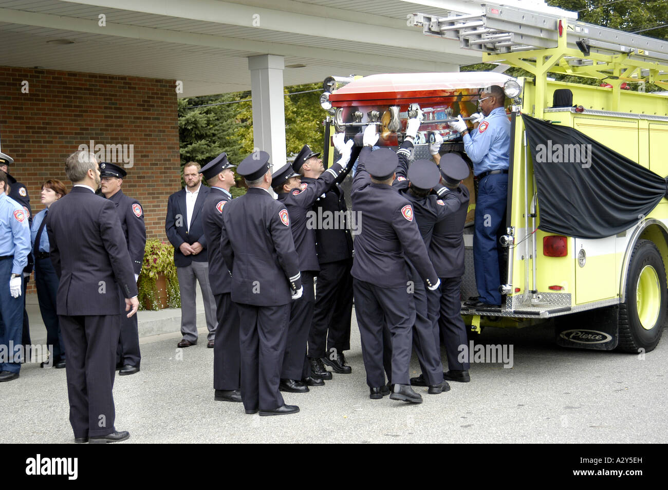 Local fire fighters and policemen attend funeral of fire chief Stock ...