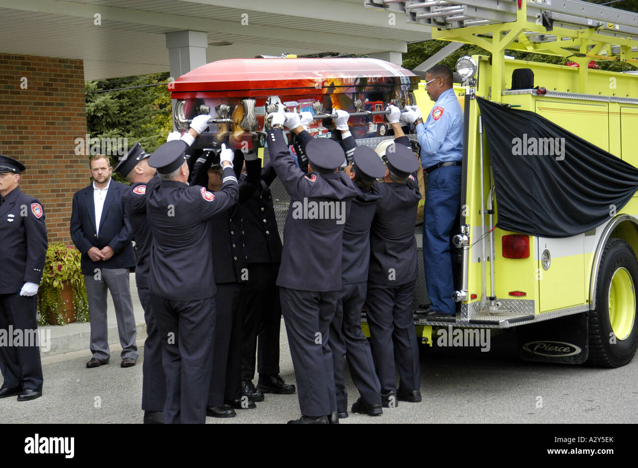 Local fire fighters and policemen attend funeral of fire chief Stock ...