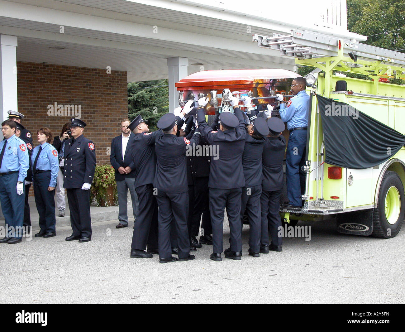 Local fire fighters and policemen attend funeral of fire chief Stock ...
