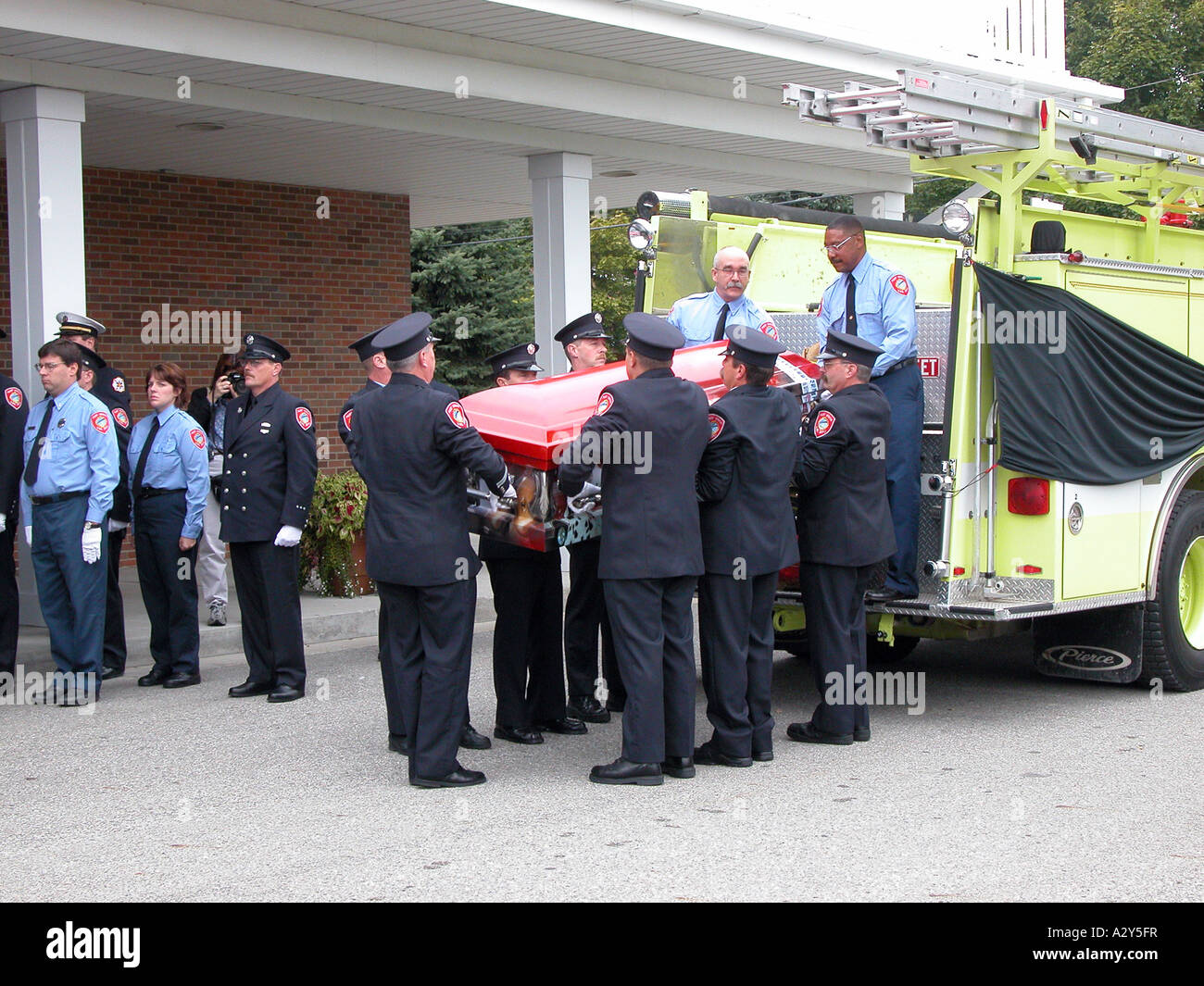 Local fire fighters and policemen attend funeral of fire chief Stock ...